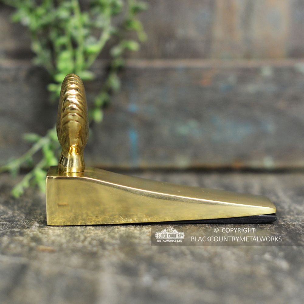 Polished Brass Shell Design Door Wedge | Black Country Metalworks